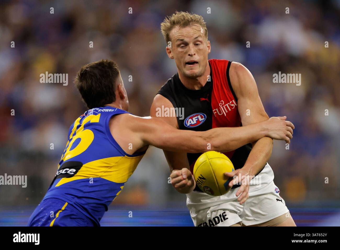 Mason Redman of the Bombers is tackled by Matthew Owies of the Eagles ...