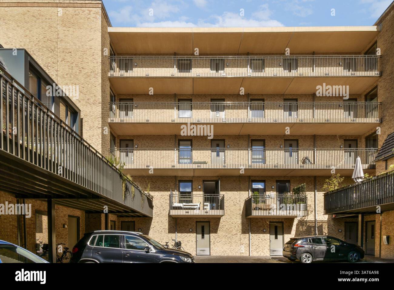 A contemporary apartment complex showcasing a minimalist architectural ...