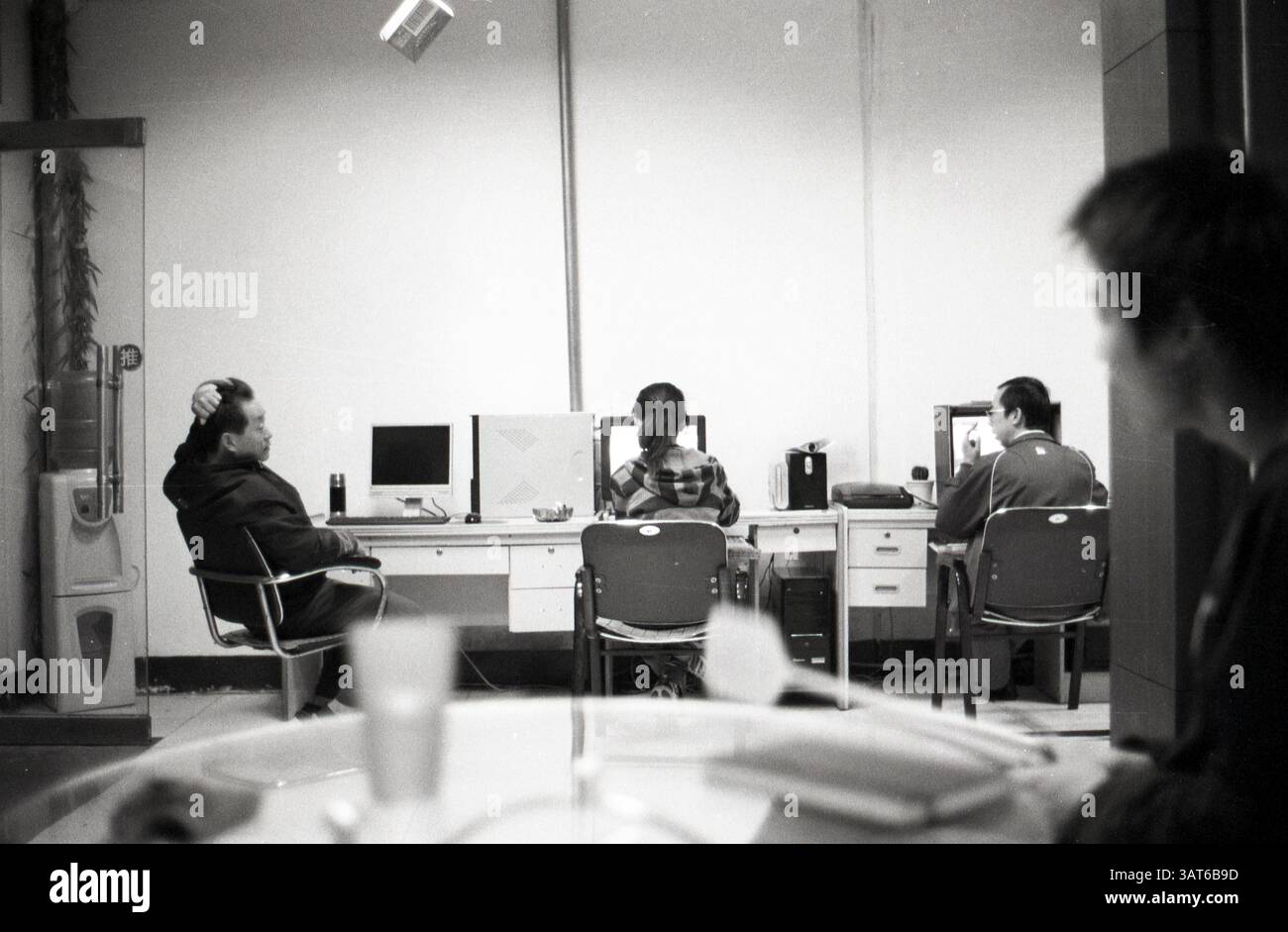 Engaged discussion among individuals in a minimalist workspace during ...