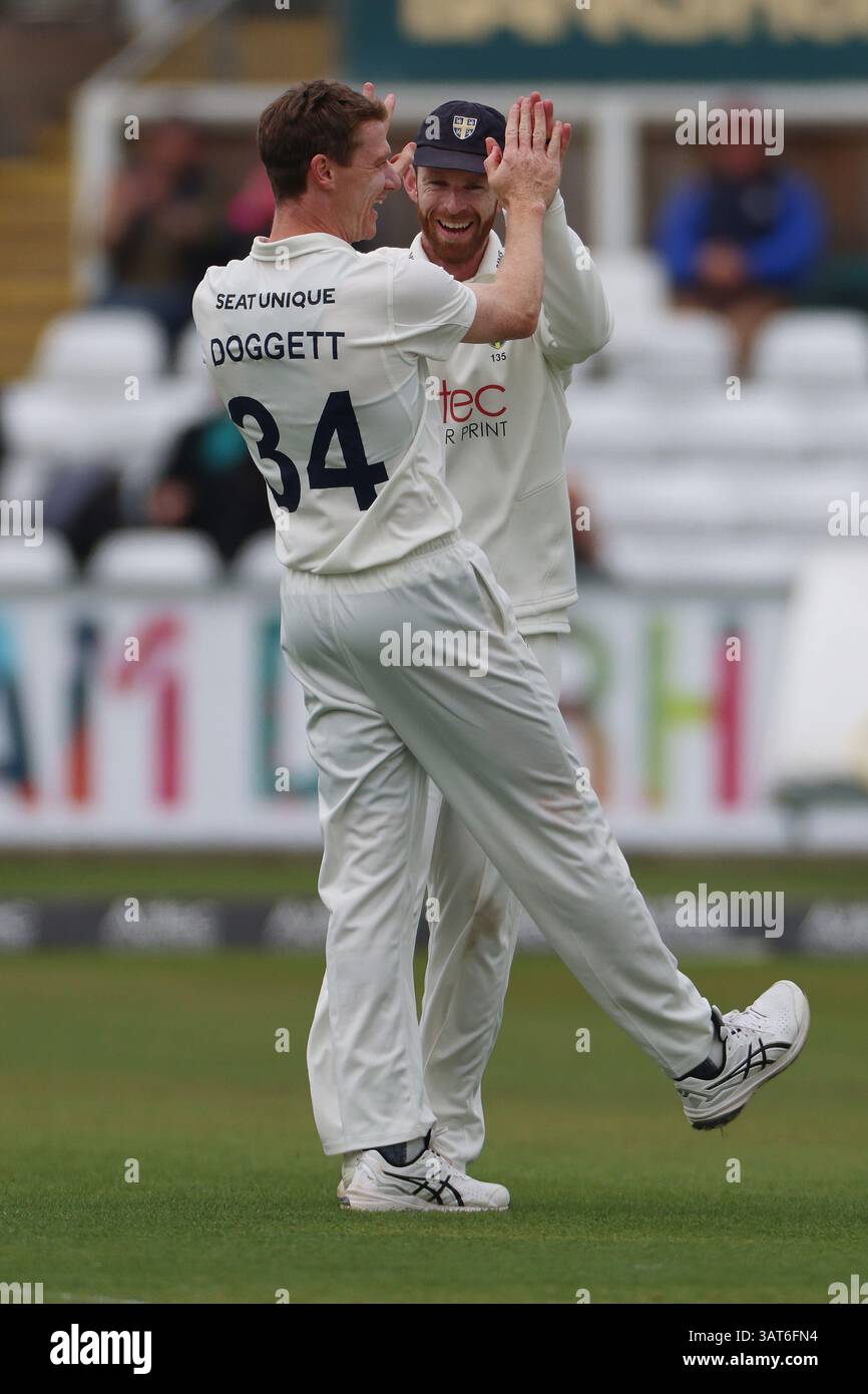 Durham's Brendan Doggett celebrates with Graham Clark after Clark ...