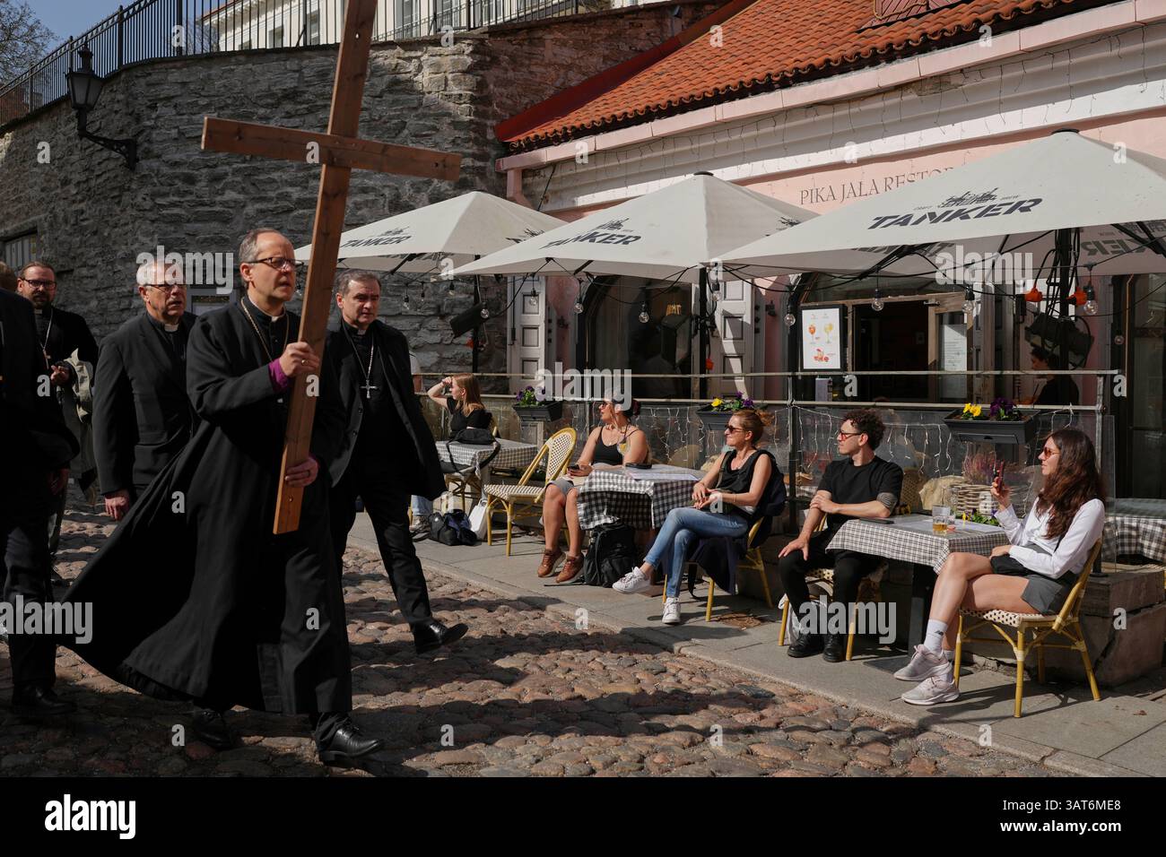 People attend the Way of Cross ceremony to mark Good Friday in the Old ...
