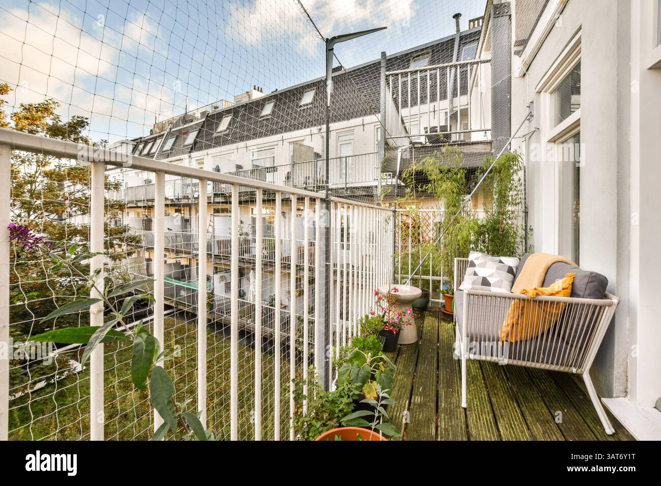 A beautifully designed balcony featuring modern furniture and vibrant ...