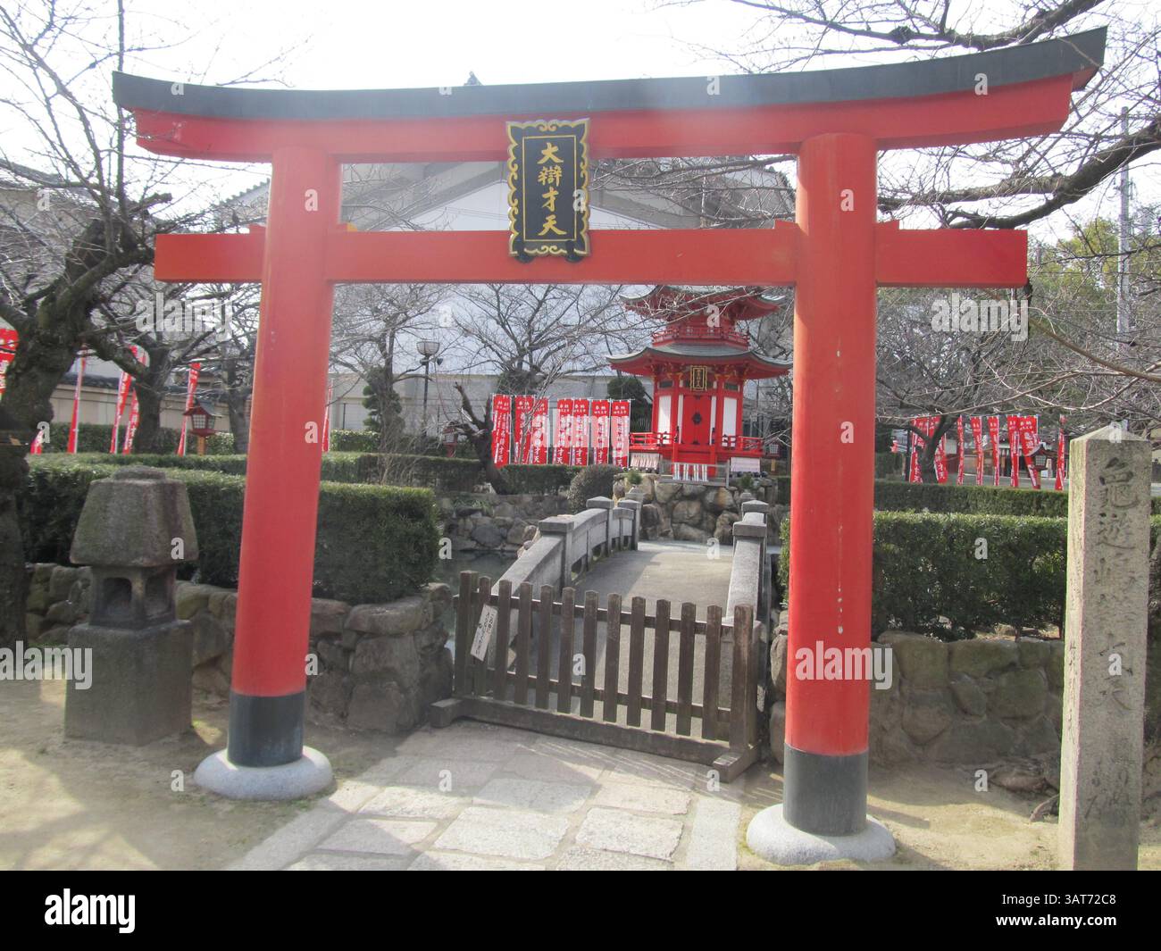 Traditional Japanese temple surrounded by lush nature, captured in a ...