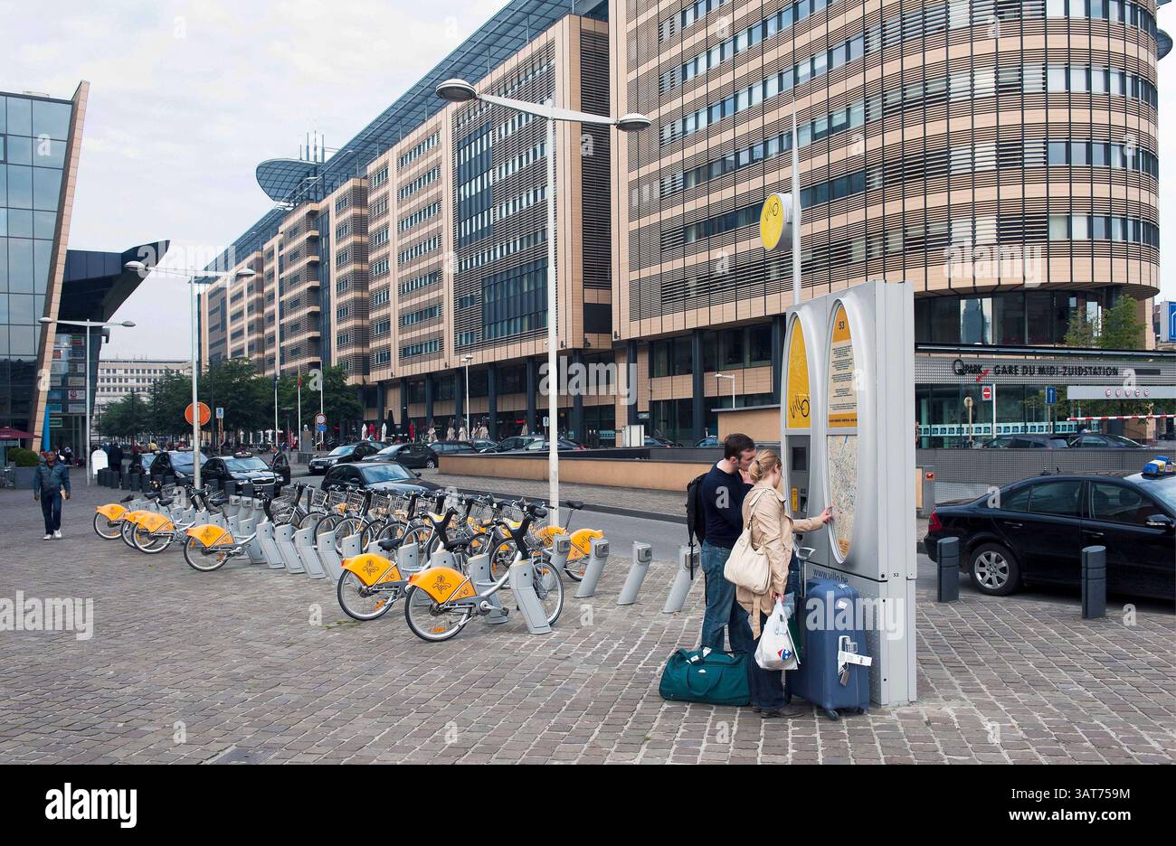 Jun 30, 2011 - Brussels, Belgium - Two tourists look at the map of ...