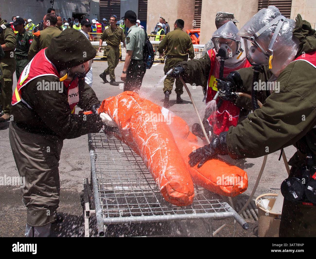 IDF soldiers in protective suits and masks decontaminate incoming ...