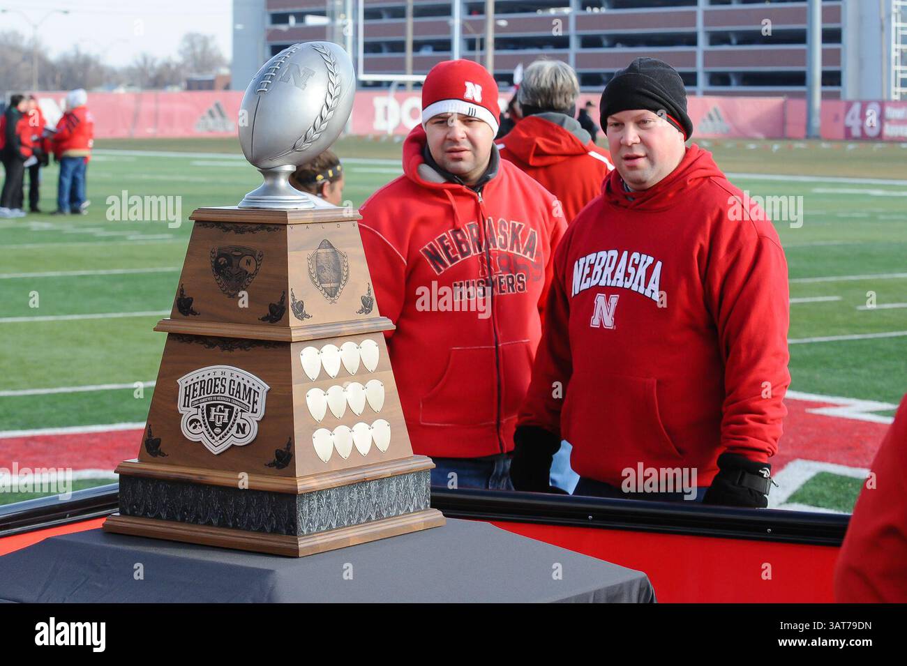 Nov. 29, 2013 - Lincoln, Nebraska, U.S - Fans look at the Heroes Game trophy prior to the game ...