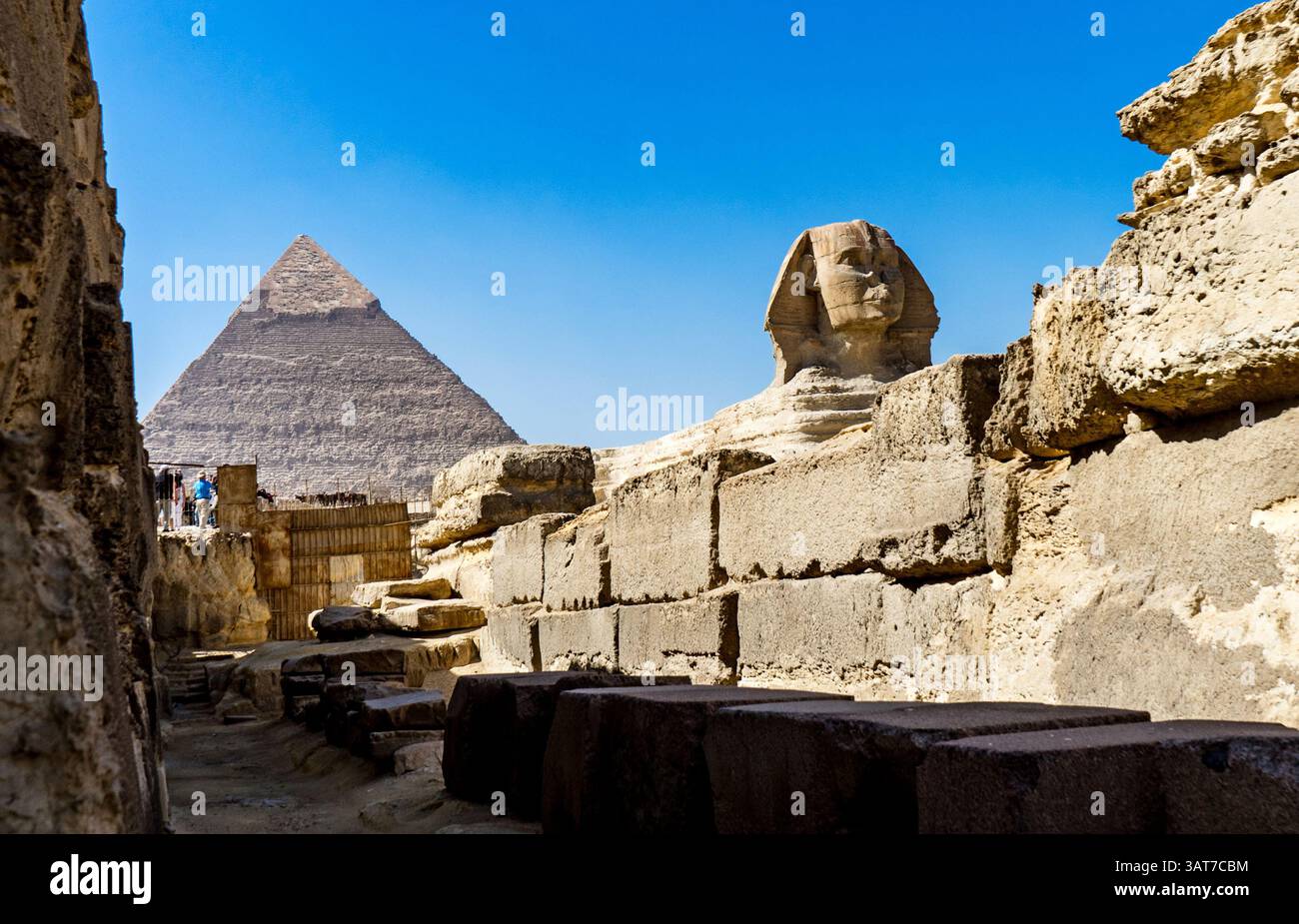 A view of the Great Sphinx of Giza with the Pyramid of Khufu in the ...