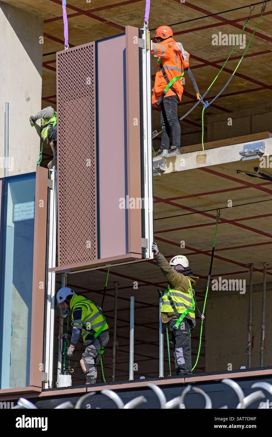 A cladding panel being installed on Tower 2 of the Michigan Towers ...