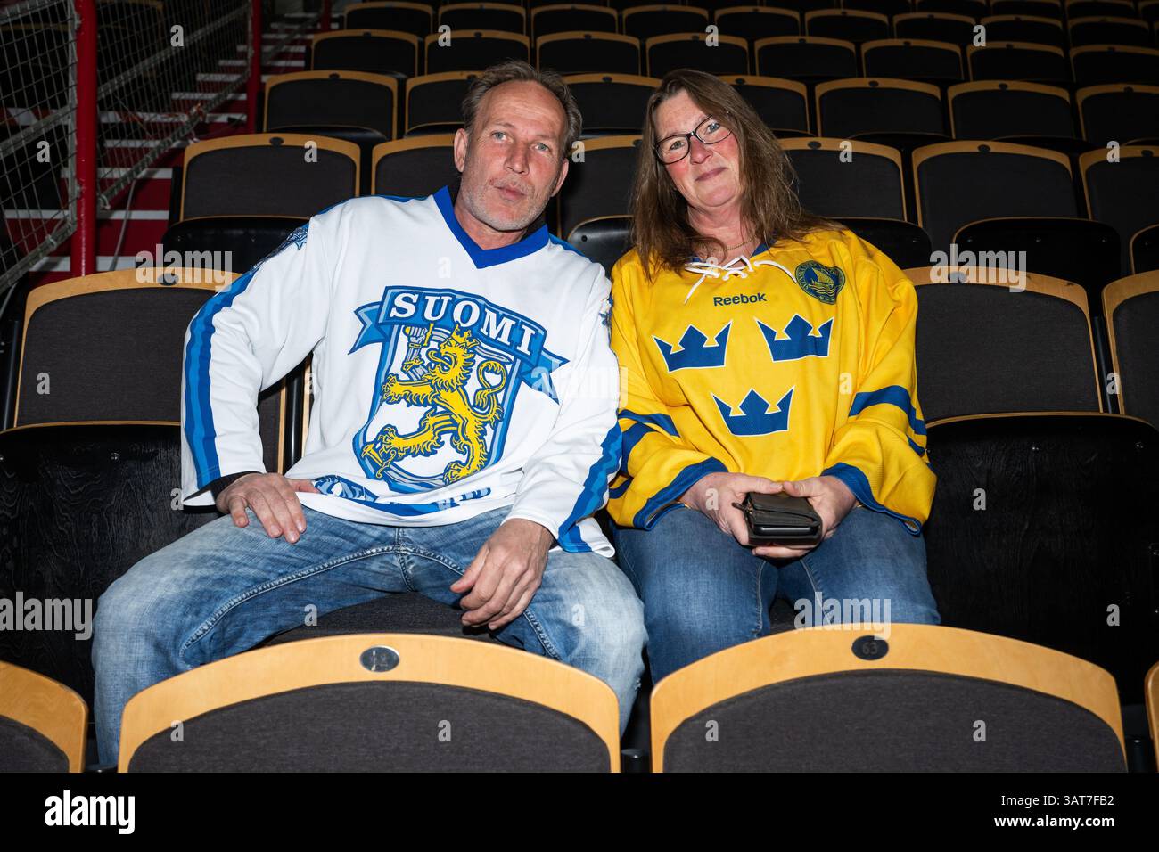 Spectators pose for a photo ahead of the international friendly ice ...