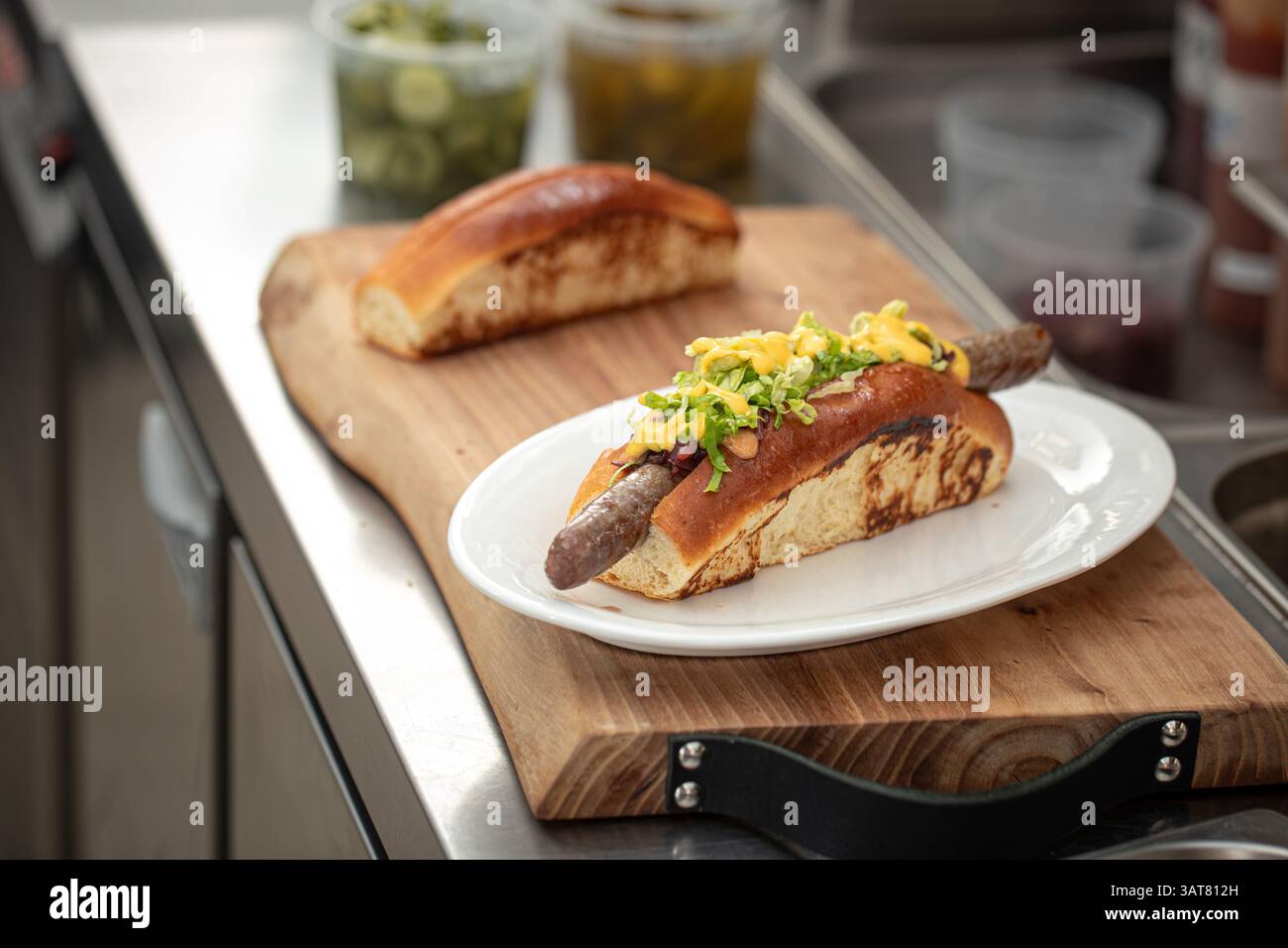 Preparing hot dogs in diner kitchen counter Stock Photo - Alamy