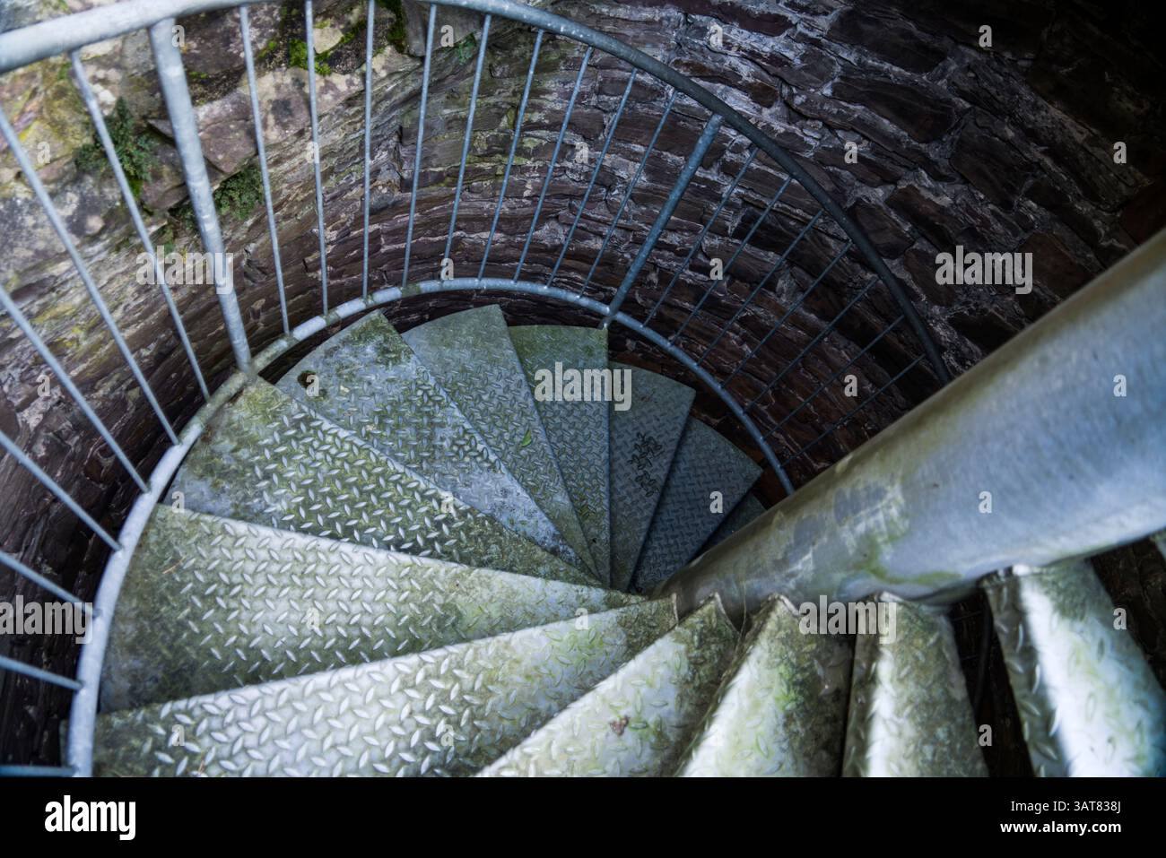 Steps of old metal spiral staircase disappear in darkness Stock Photo ...