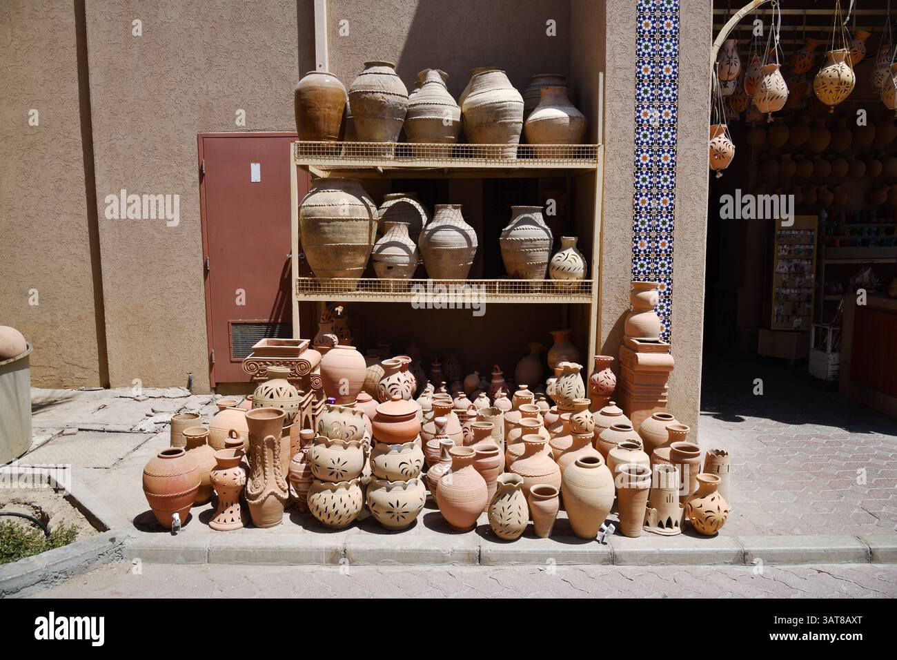 Sultanate of Oman. Old town of Nizwa, Souq. Traditional omani clay pots ...