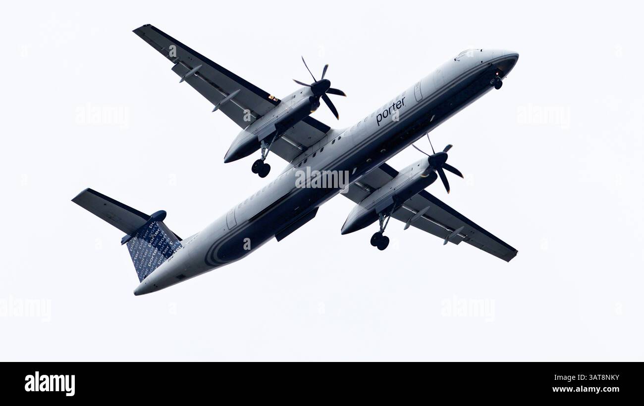 A Porter Airlines De Havilland Canada Dash 8-400 turboprop from Toronto arriving at Boston's ...