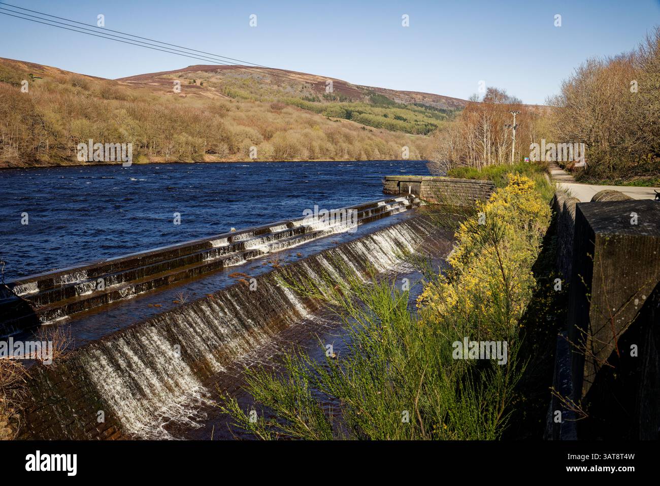 Water cascading down the overflow spillway of Rhodeswood Reservoir ...