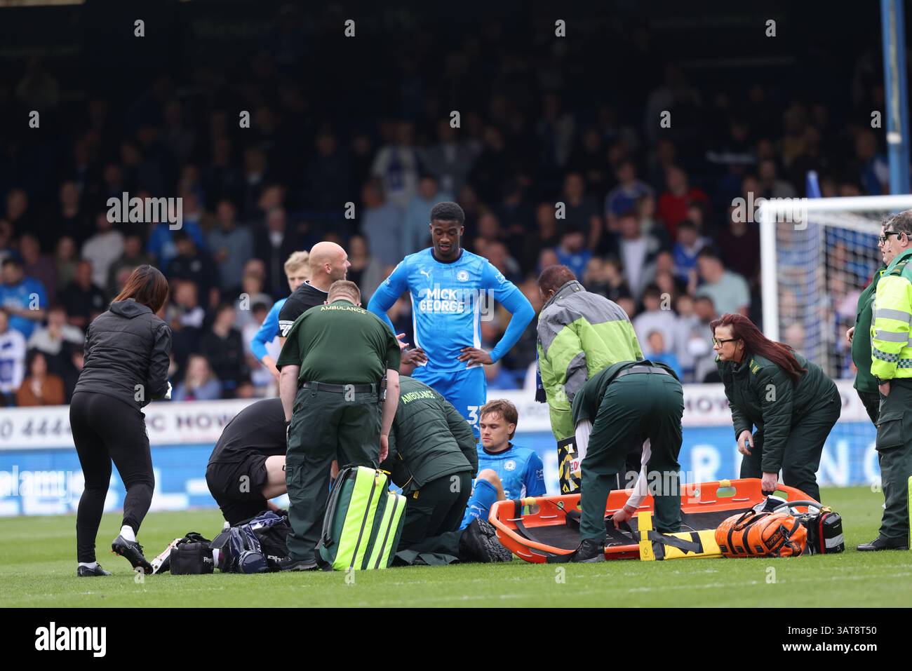 Archie Collins (PU) waits to be put on a stretcher after his injury at ...