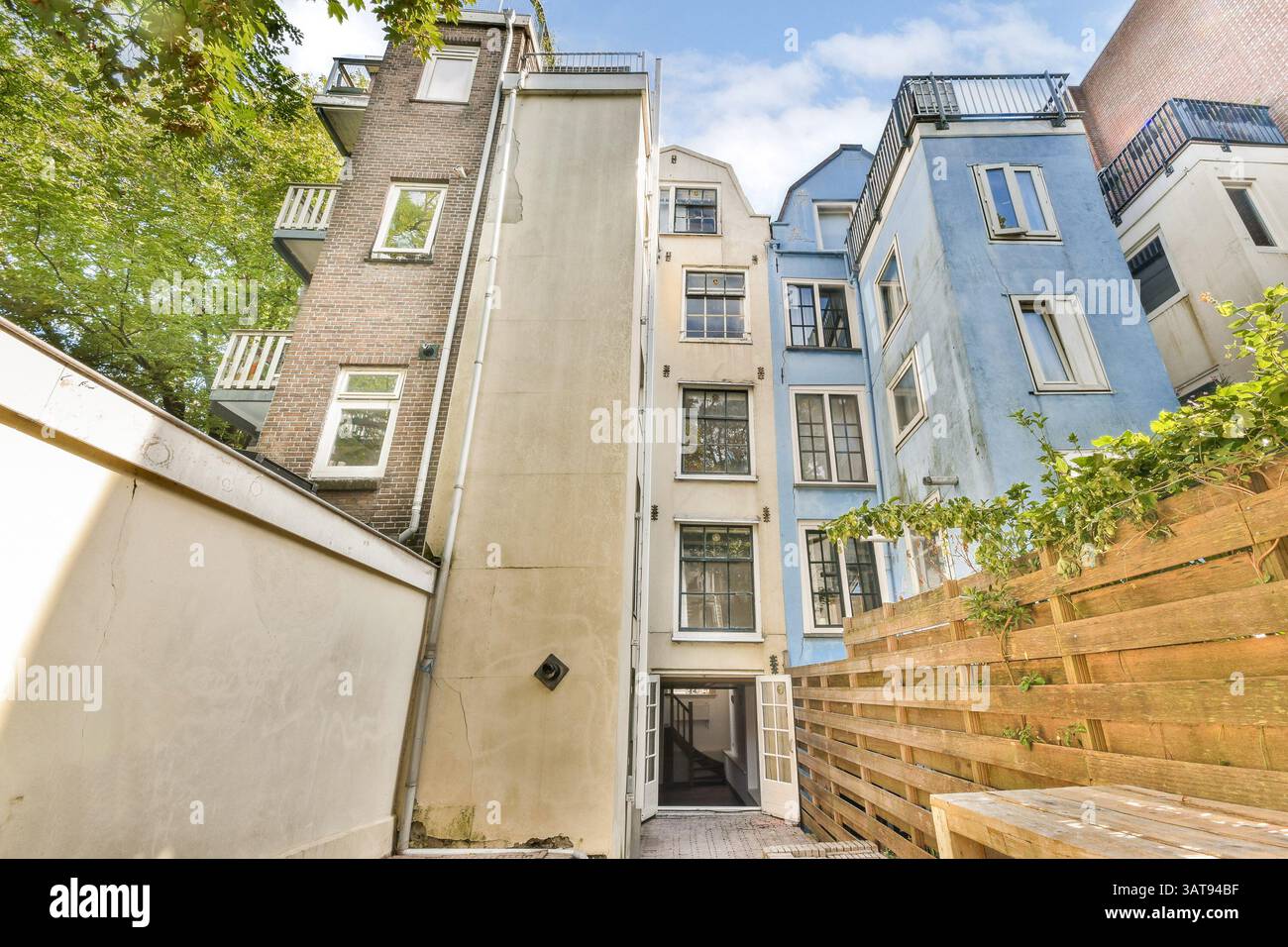 A picturesque view of two distinct styles of urban buildings framed by ...