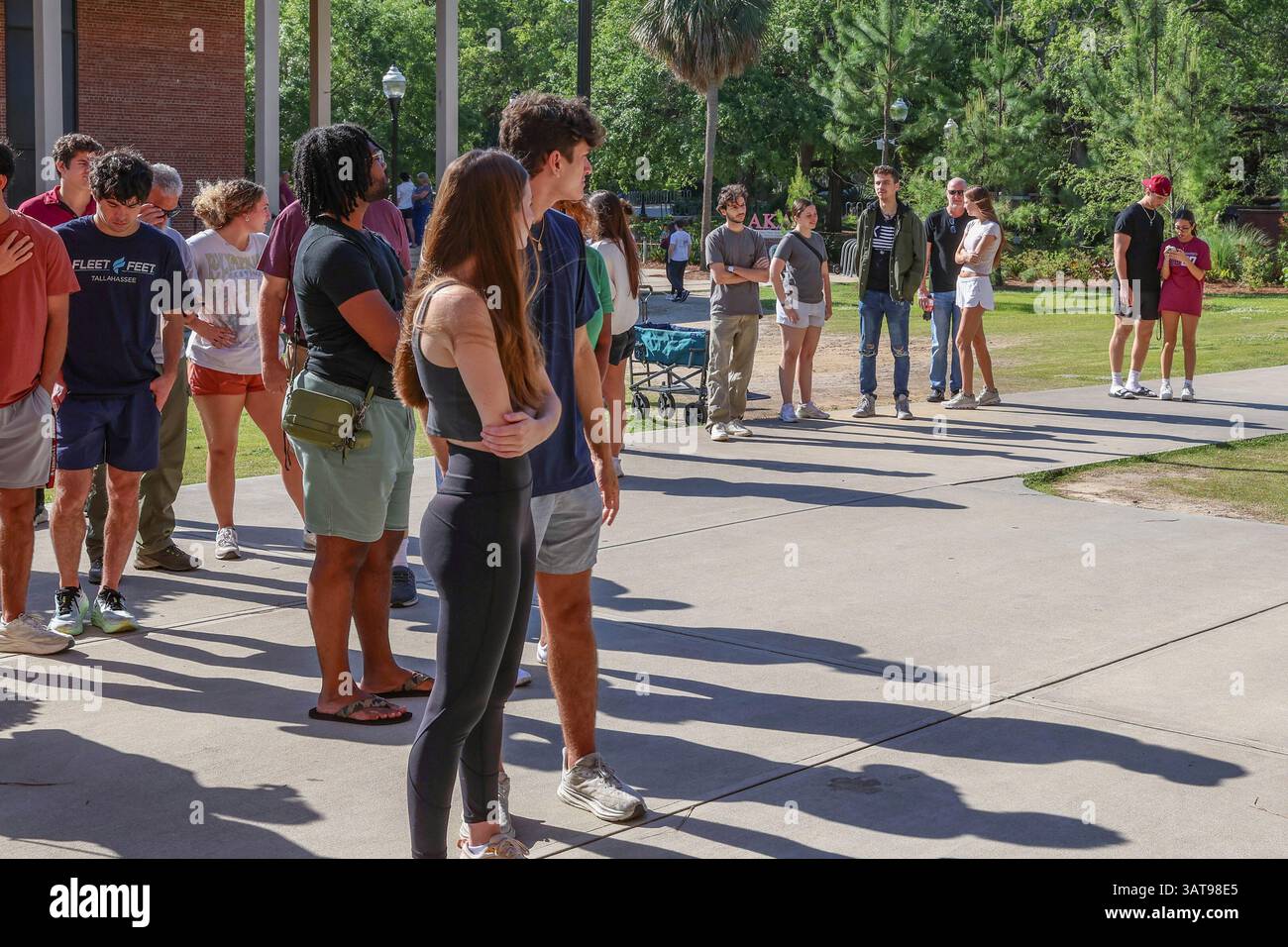 Students wait to retrieve their personal items from the Florida State ...