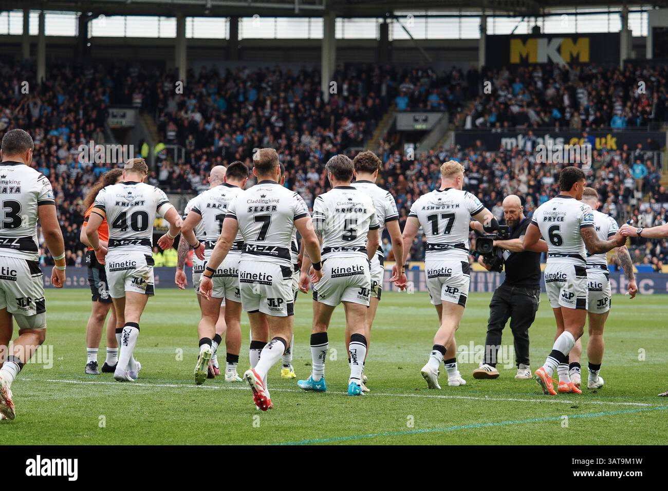 The Hull FC team walk back up the pitch during the Betfred Super League ...