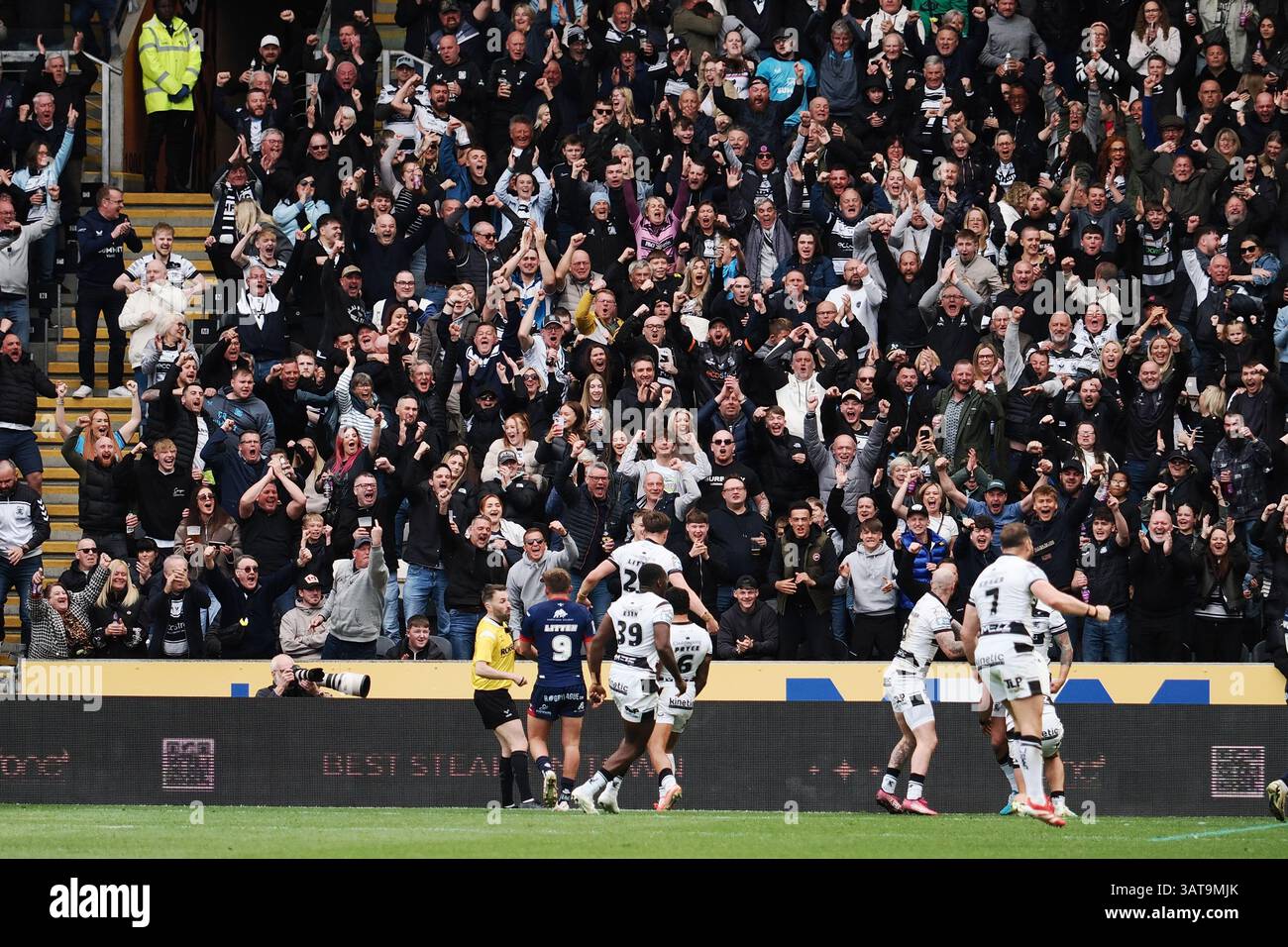 Hull FC players celebrate with the fans after scoring a try during the ...