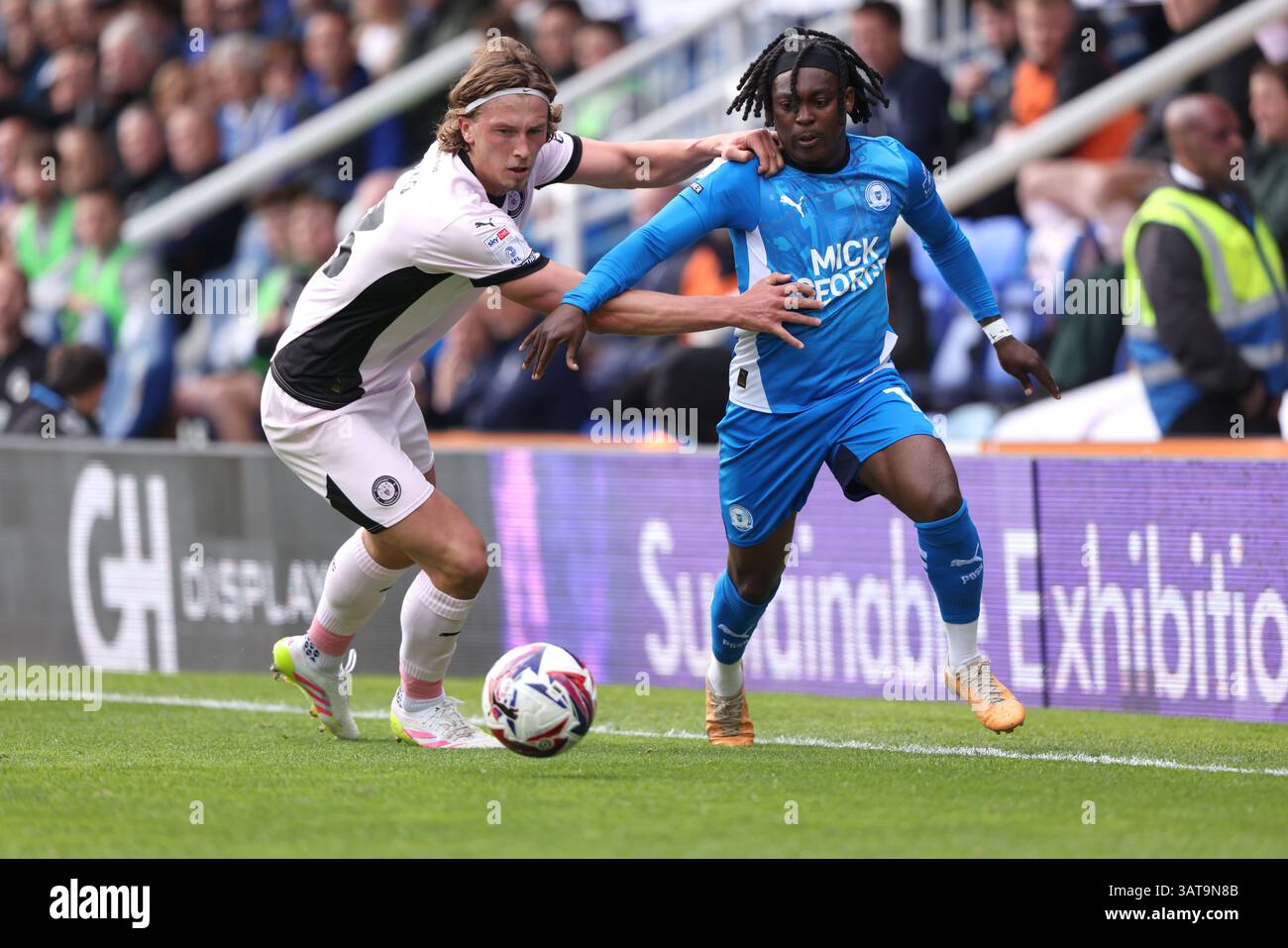 Peterborough, UK. 18th Apr, 2025. Brad Hills (SC) Abraham Odoh (PU) at ...