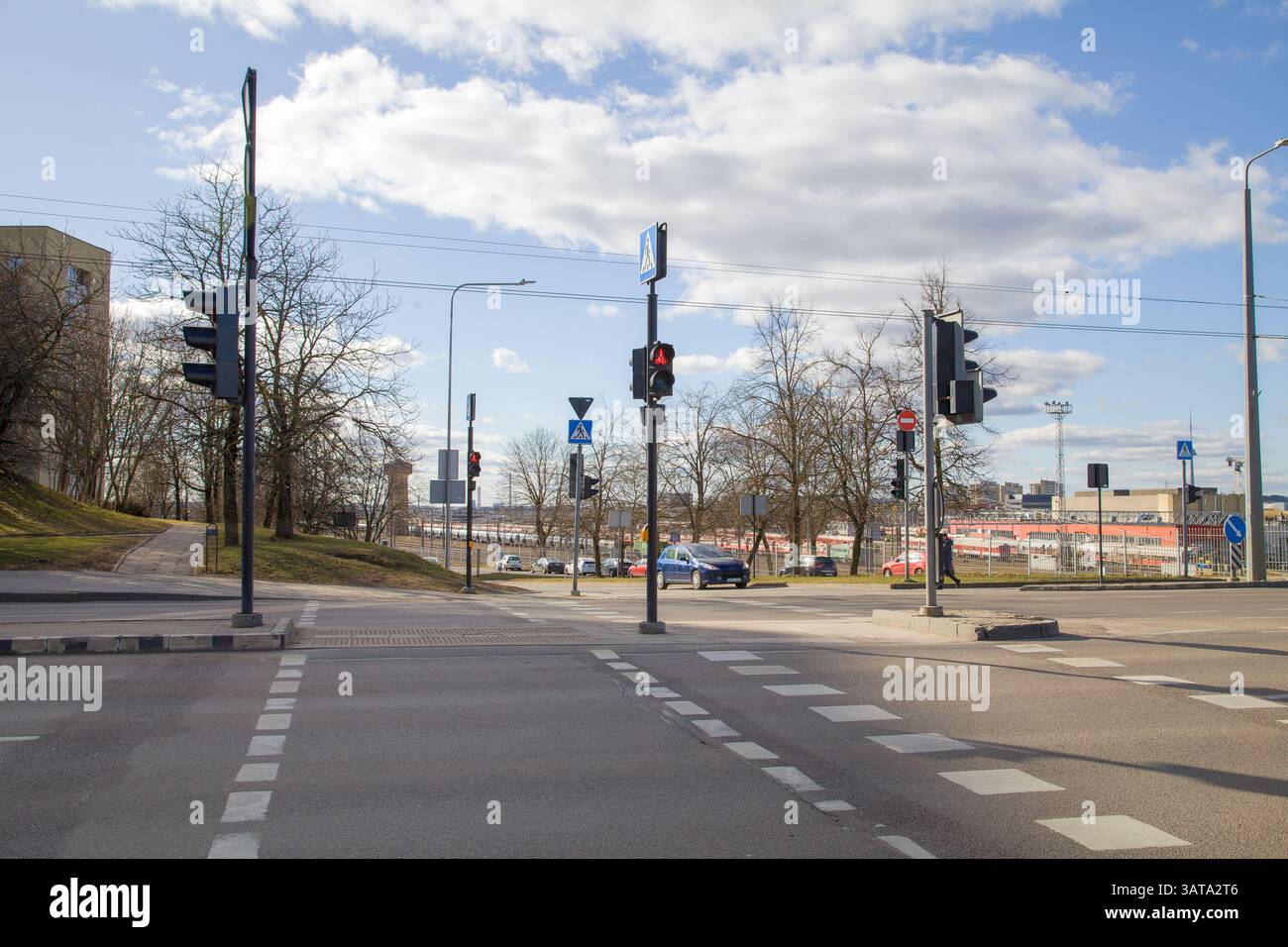 Red traffic light at an urban intersection with pedestrian and bicycle ...