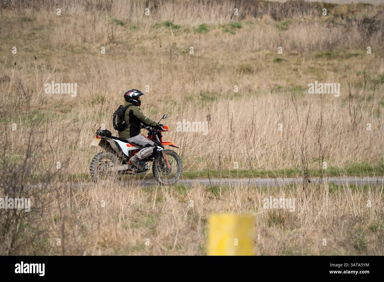 motor cyclist (biker) riding their off-road motorbike through ...