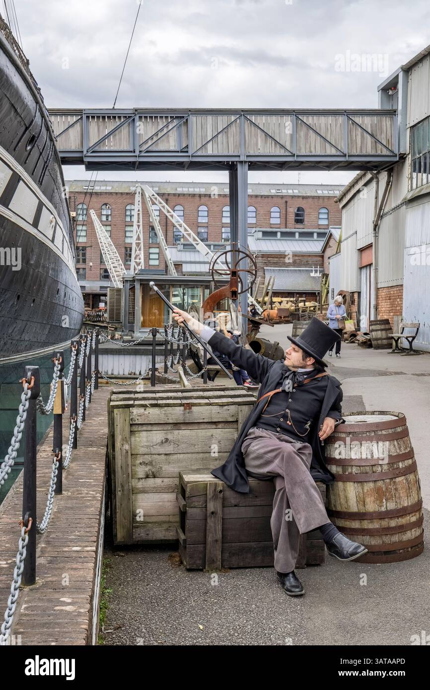 Actor dressed as Isambard Kingdom Brunel sat on vintage boxs pointing ...