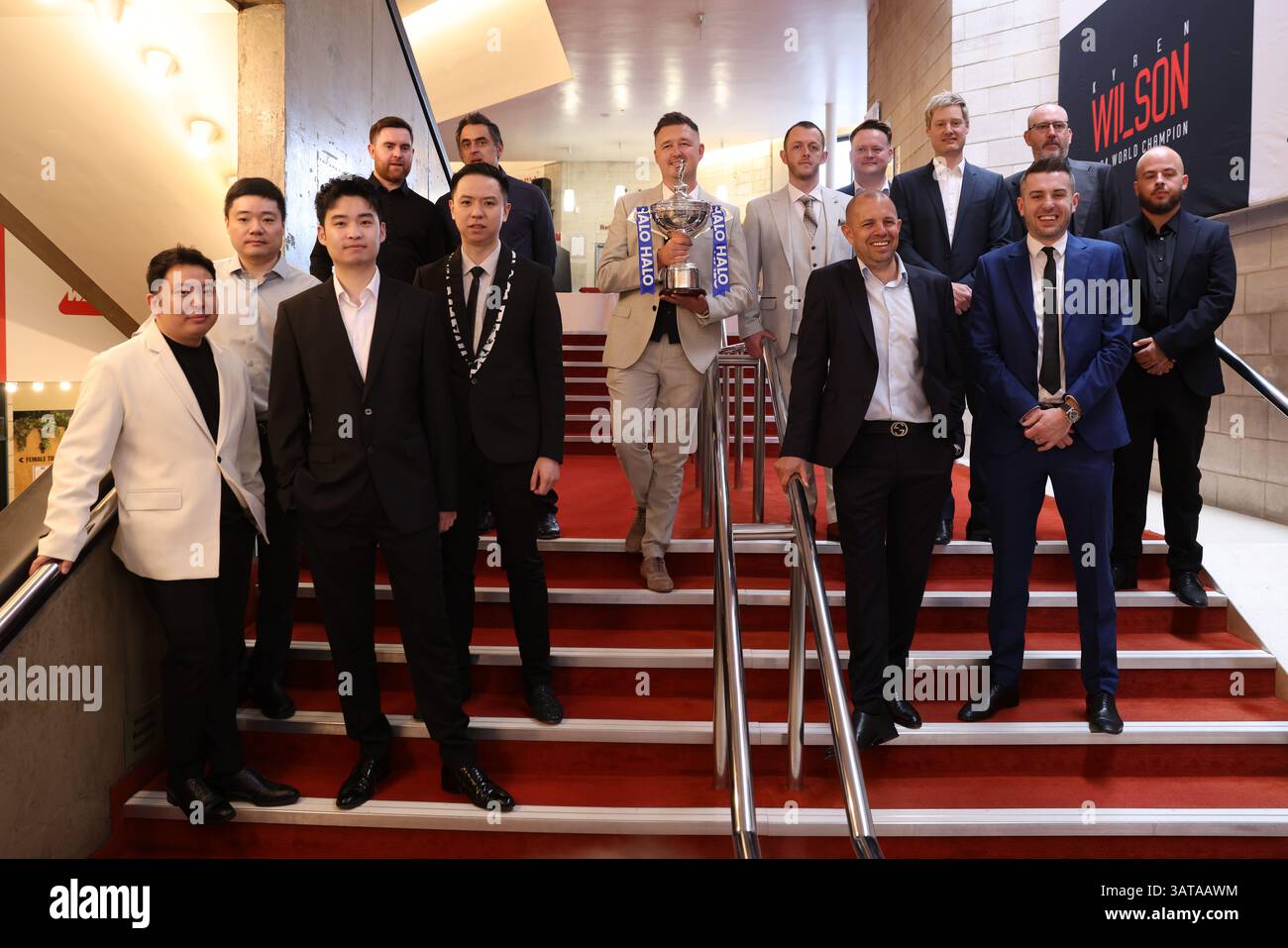 The world top 16 pose for a photo with the world trophy during the 2025 ...
