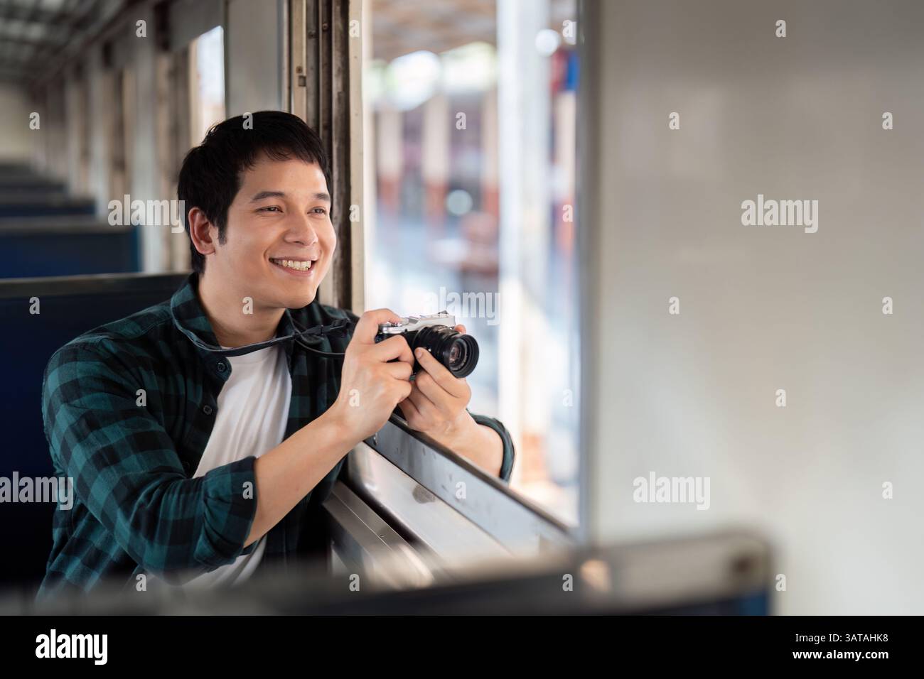 Photography and Adventure. A young traveler capturing moments with a ...