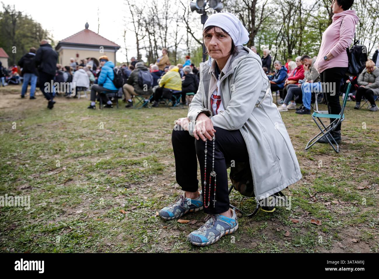 A pilgrim pray during the procession in the Way of the Cross during the ...