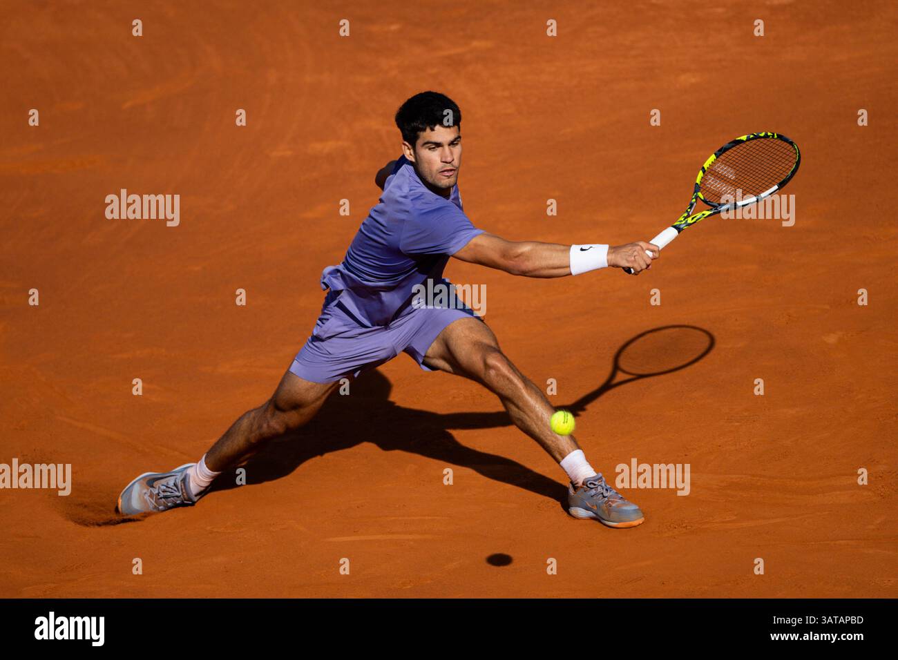 Carlos Alcaraz of Spain plays a backhand against Alex de Minaur of ...