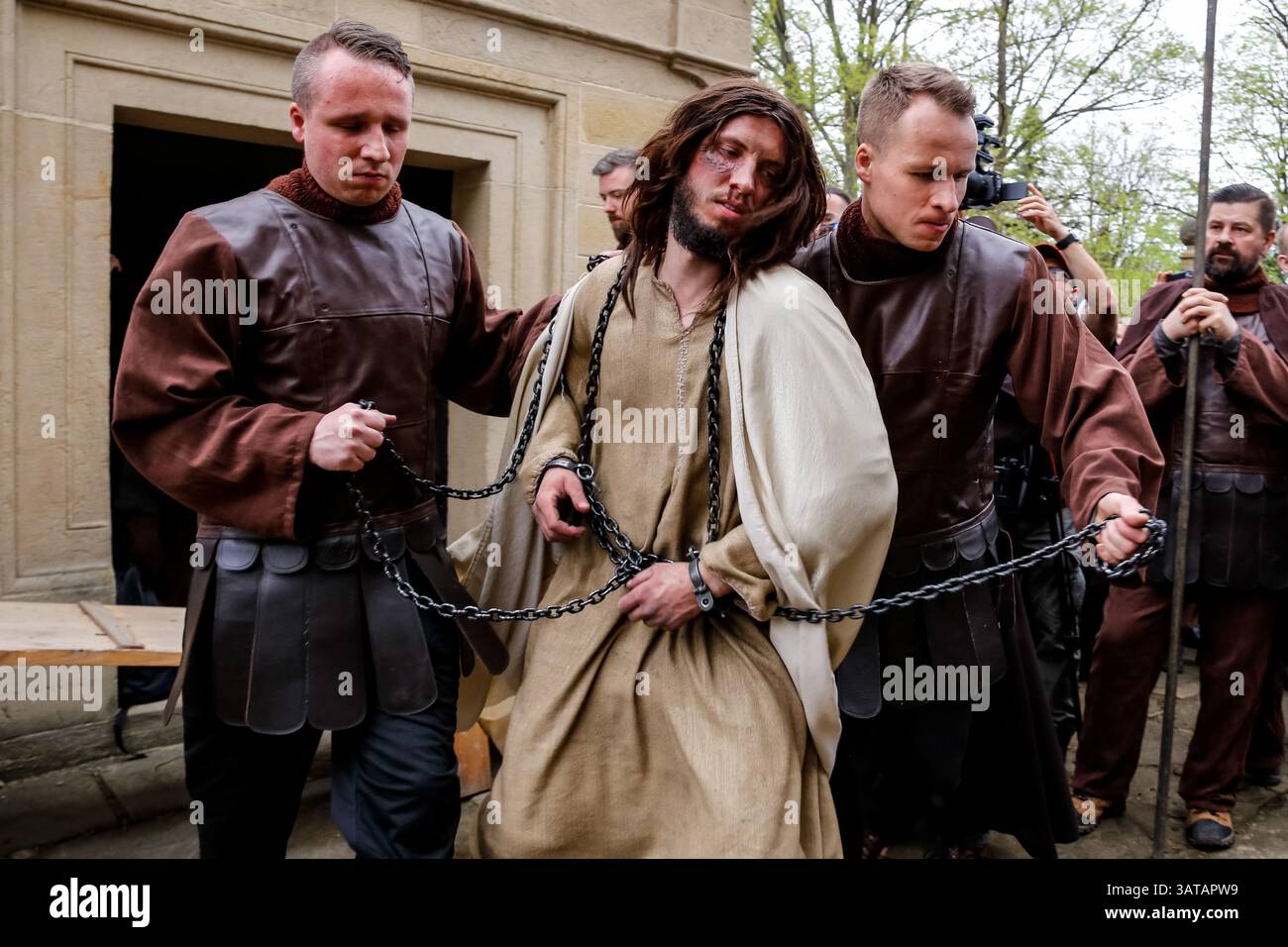 Actors playing Jesus from Nazareth and Roman guards walk in the ...