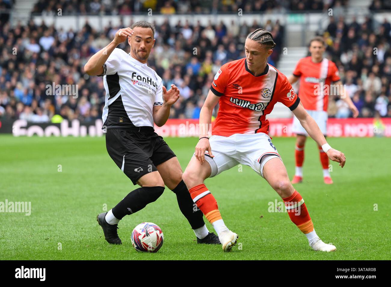 Thelo Aasgaard of Luton Town under pressure from Kane Wilson of Derby ...