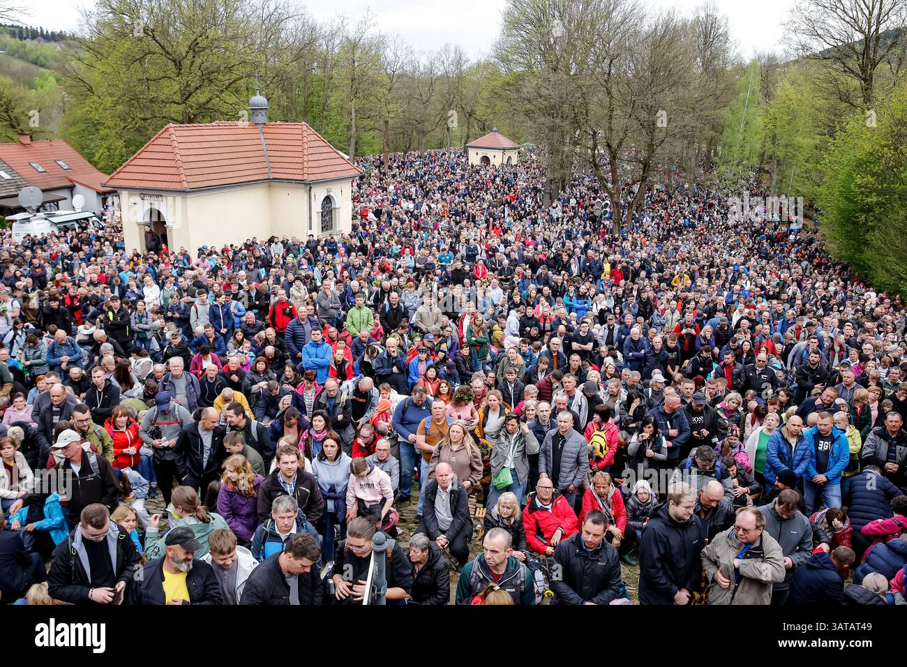 Pilgrims attend the procession in the Way of the Cross during the ...