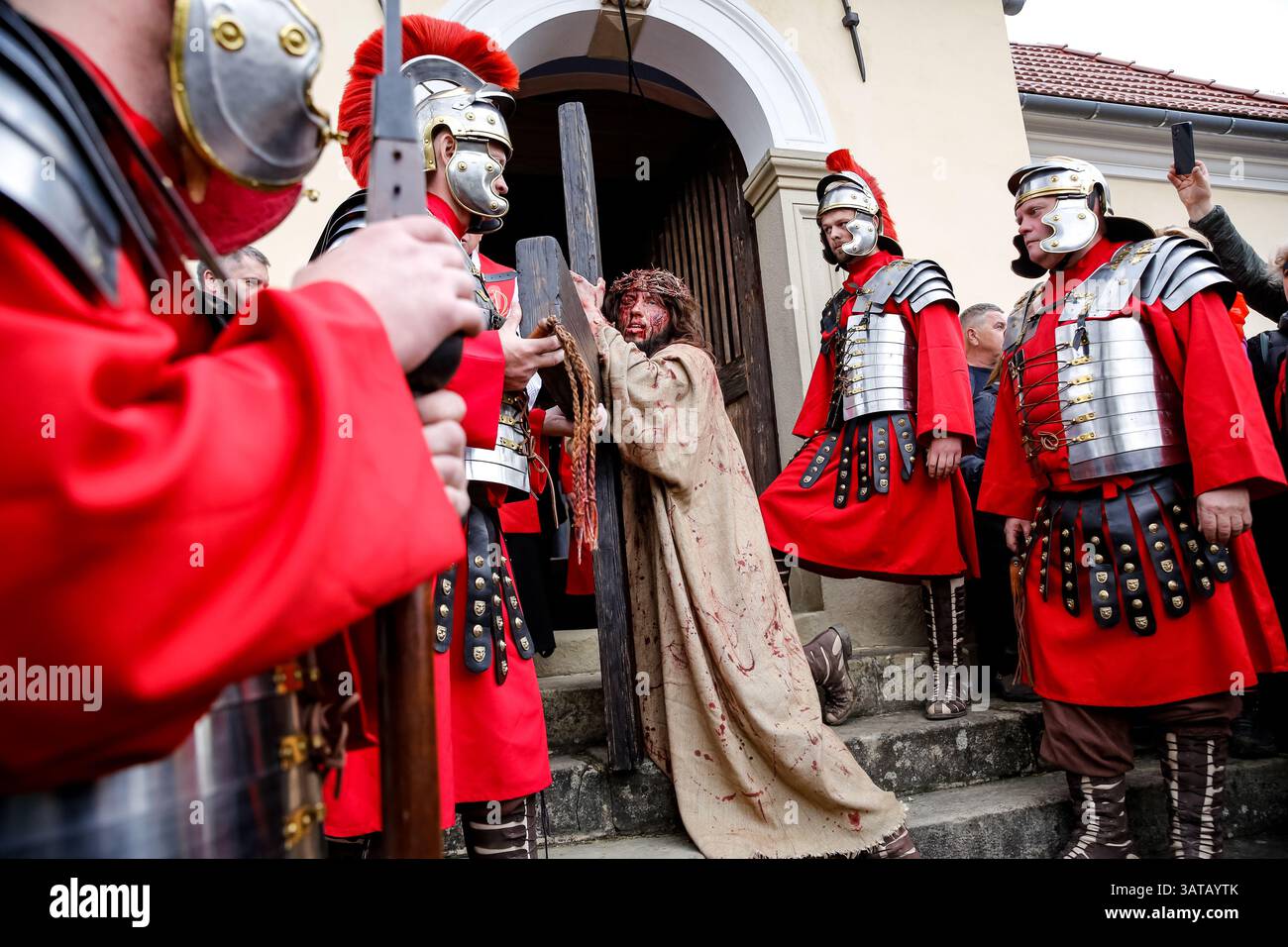 Actors playing Jesus from Nazareth and Roman guards walk in the ...
