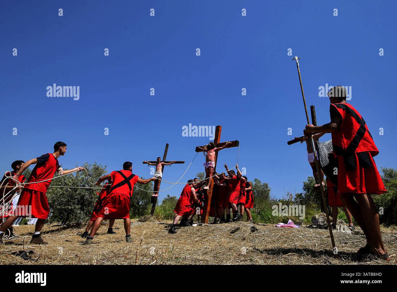 18 April 2025, Lebanon, Qraiyeh: A Christian youth, portraying Jesus ...