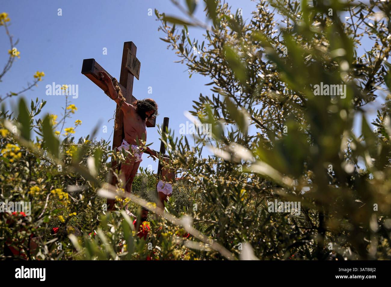 Qraiyeh, Lebanon. 18th Apr, 2025. A Christian youth, portraying Jesus ...