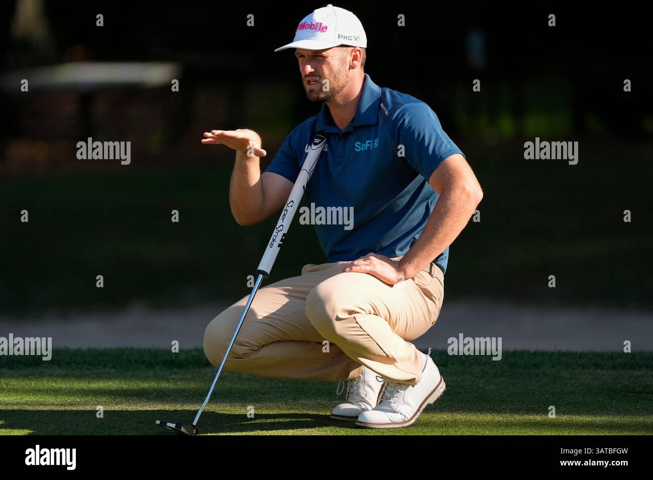 Wyndham Clark lines up a putt on the first green during the second ...