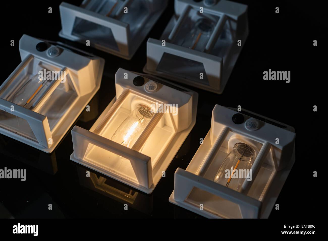A close-up view of several modern light fixtures arranged in a grid ...