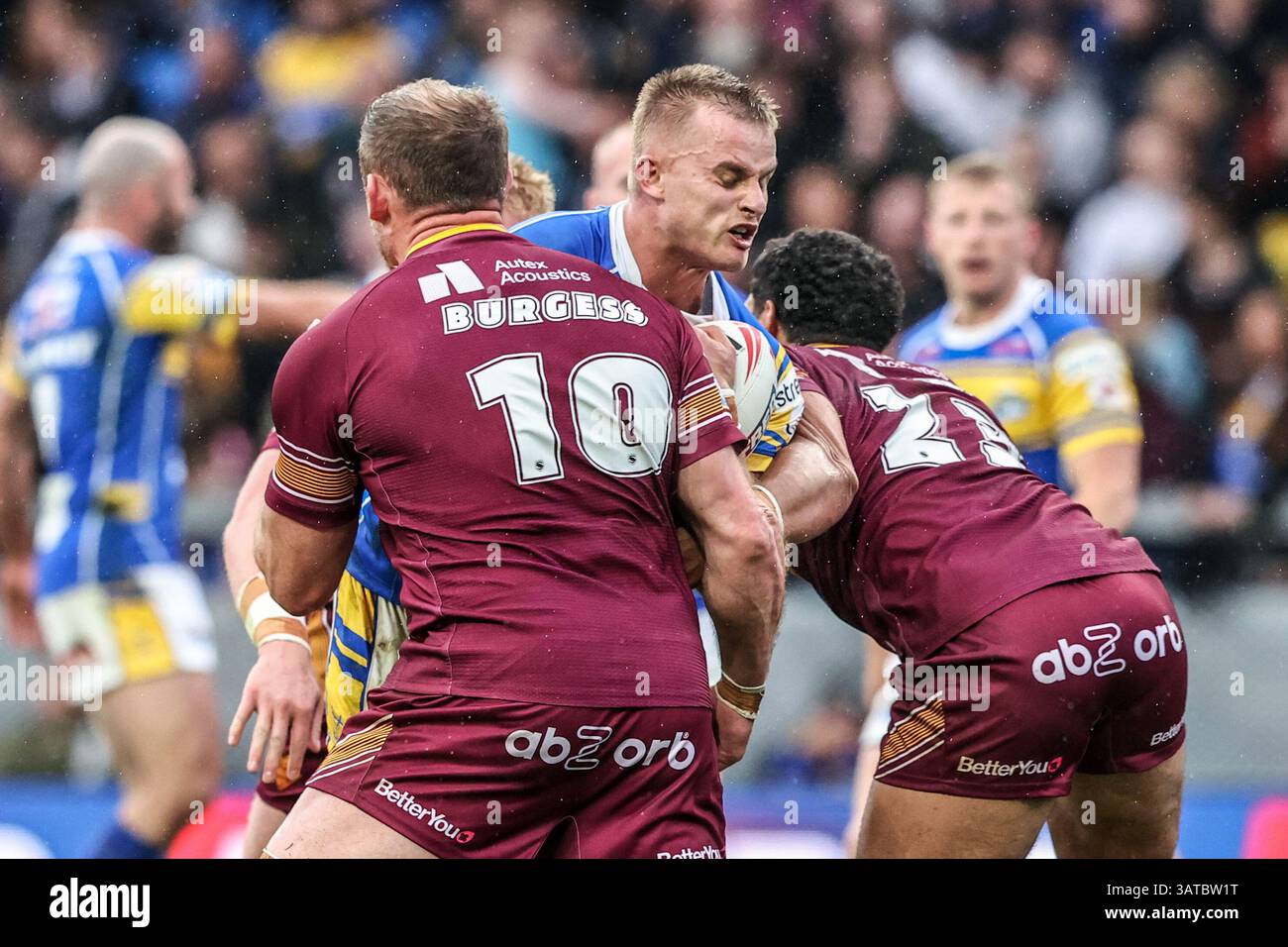 Leeds, UK. 18th Apr, 2025. Cooper Jenkins of Leeds Rhinos is tackled by ...