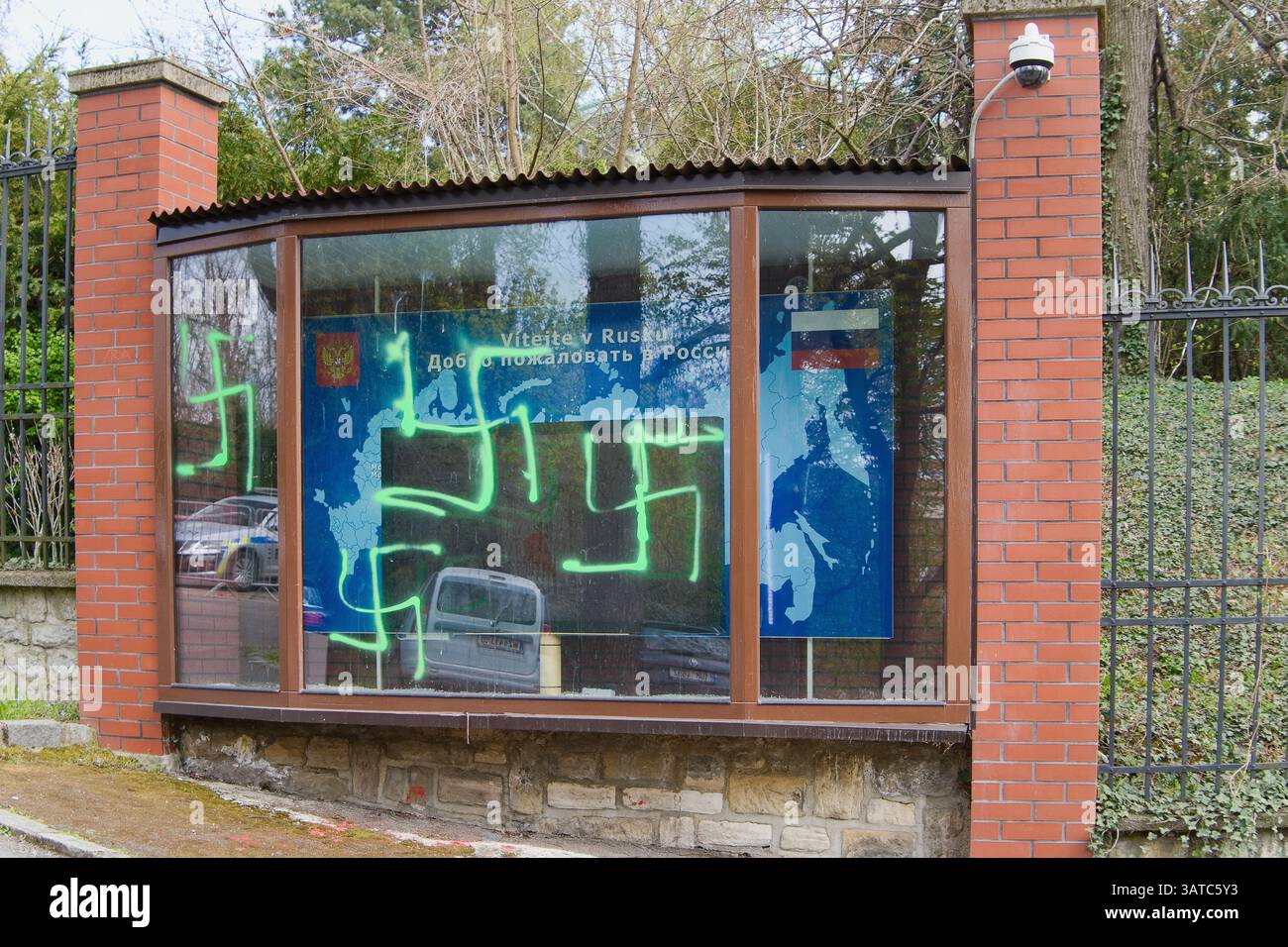 Spray-painted fascist swastikas on the window of the Embassy of the ...