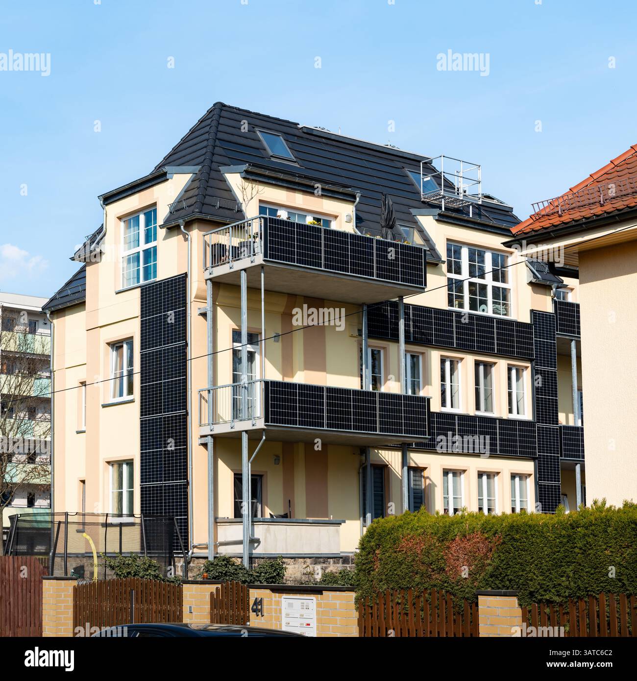 Solar panels on the facade of a residential building. Generating green ...