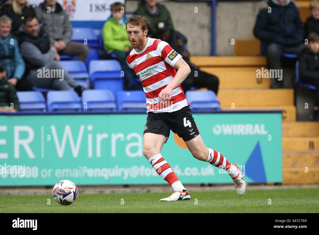 Birkenhead, UK. 18th Apr, 2025. Tom Anderson of Doncaster Rovers in ...