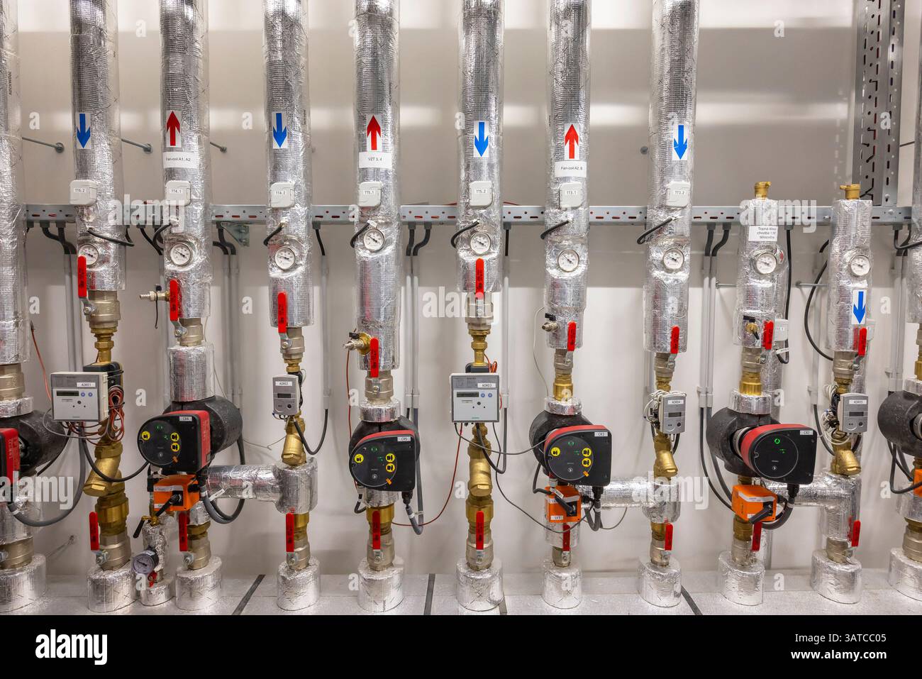 Complex plumbing system with insulated pipes, pumps, and valves ...