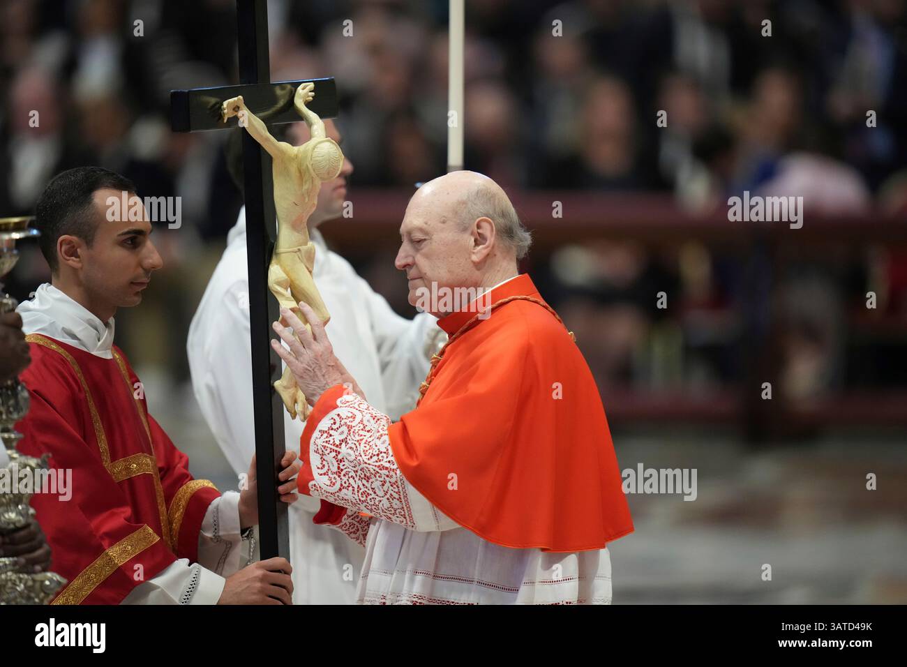 Cardinal Gianfranco Ravasi kisses a crucifix during a Good Friday ...