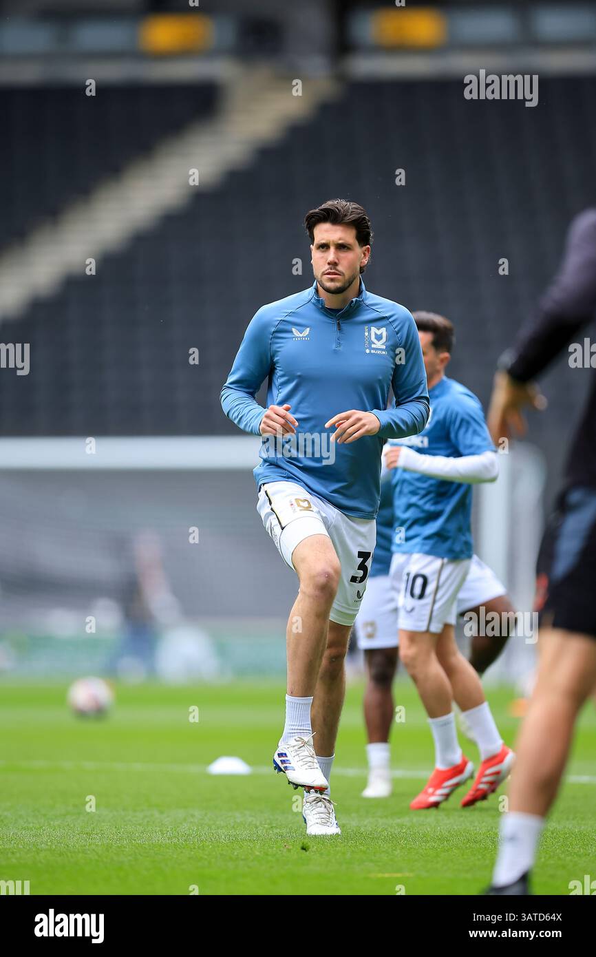 Milton Keynes Dons Defender Jack Sanders (32) Warms Up before kick-off ...