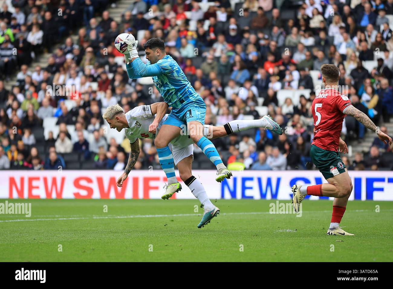Newport County Goalkeeper Nick Townsend (1) cleans out Milton Keynes ...