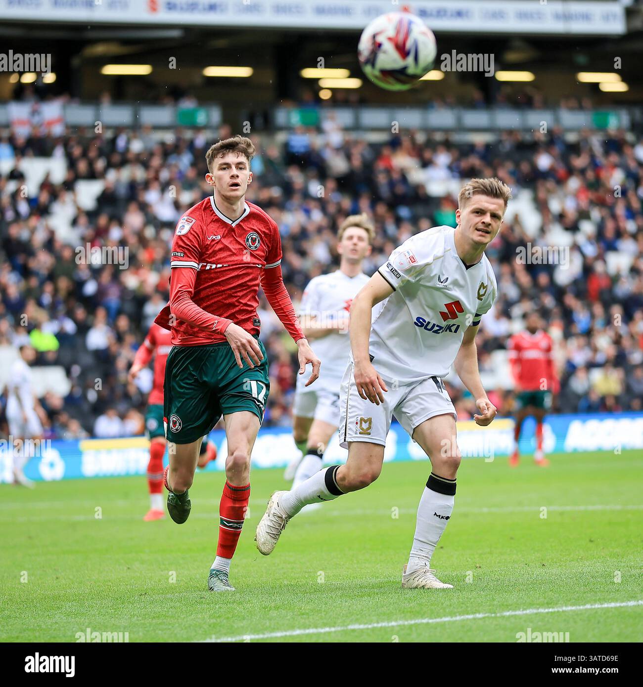 CHANCE Milton Keynes Dons Defender Joe Tomlinson (14) loses out on the ...