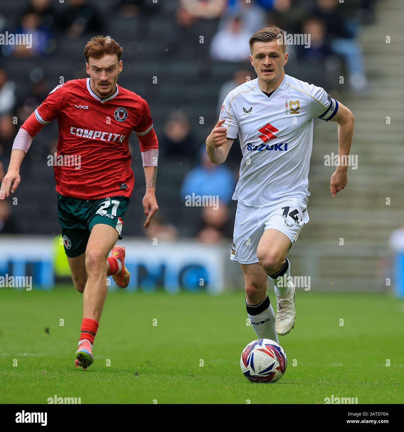 Milton Keynes Dons Defender Joe Tomlinson (14) runs at Newport County ...