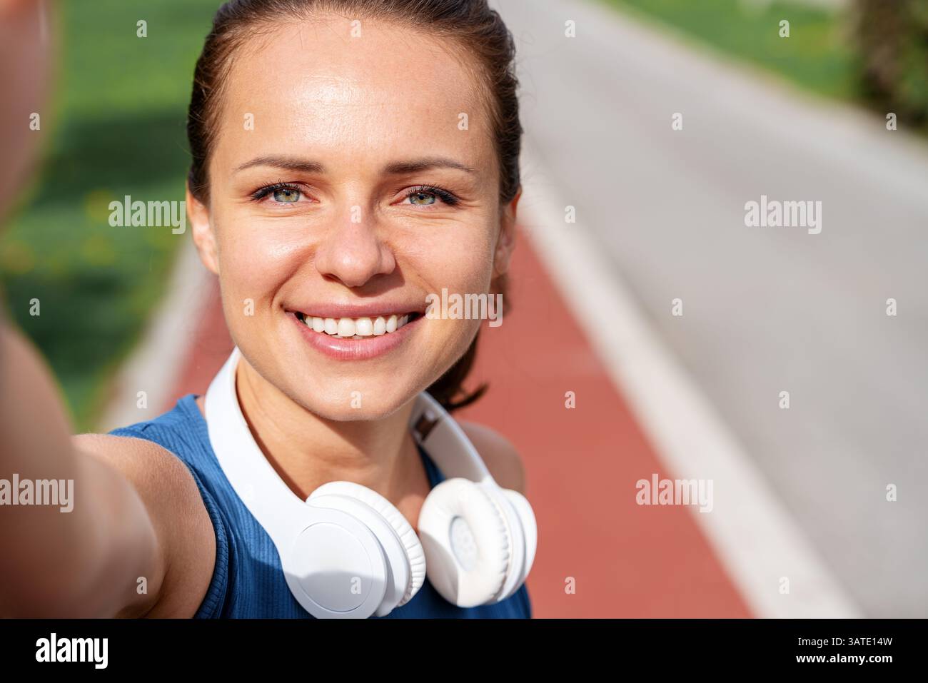 close-up self-portrait of fit woman runner on run track in city Stock ...